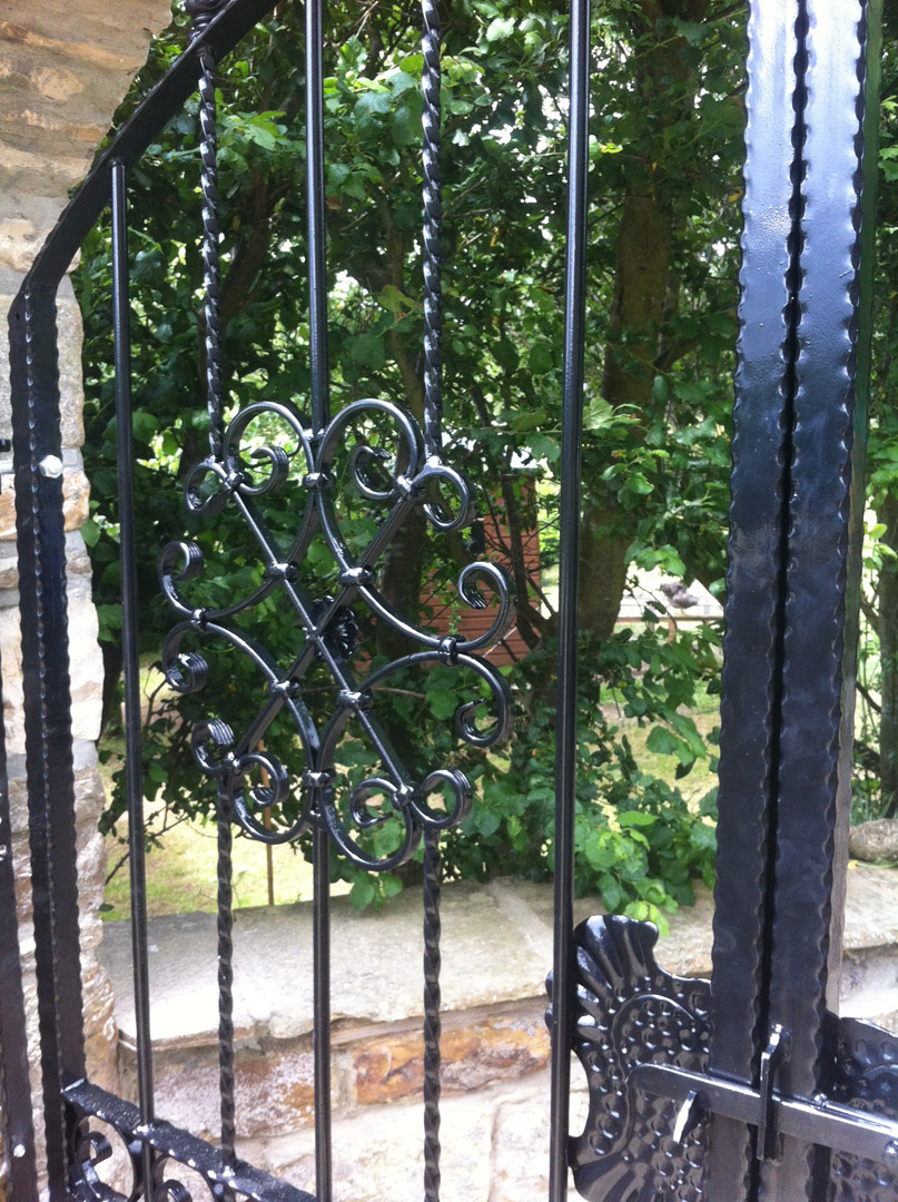 Ornate arched gate with matching rails, Haydon Bridge, Northumberland ...